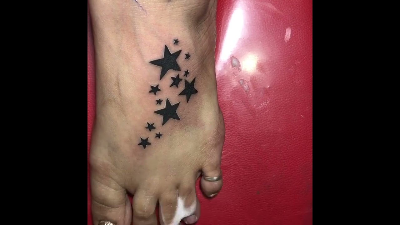 stars tattoo on feet