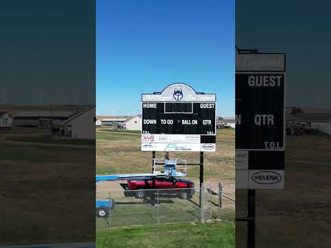 Working On A Football Field Scoreboard | DJI Mini 3 Footage