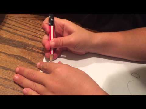 Aerison writes his name