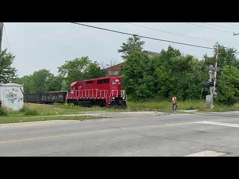 Trillium Rail GP35 3502 leads 7 gondolas through Hagar st. in Welland, ON.