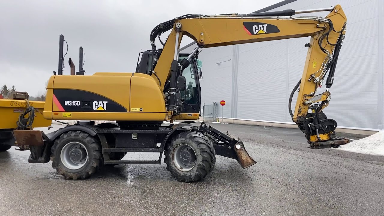 Grävmaskin med kärra och 10 redskap CAT M315D