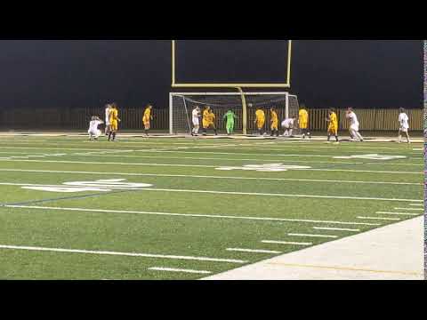 Kevin Kiernan sends a header over the bar