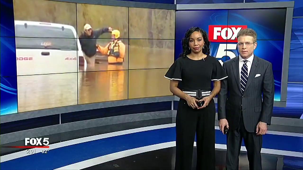 Rescuers save driver stranded in flood