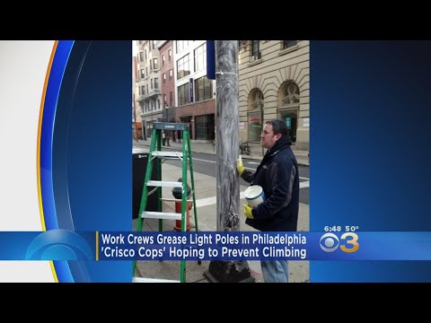 Work Crews Grease Light Poles In Philadelphia