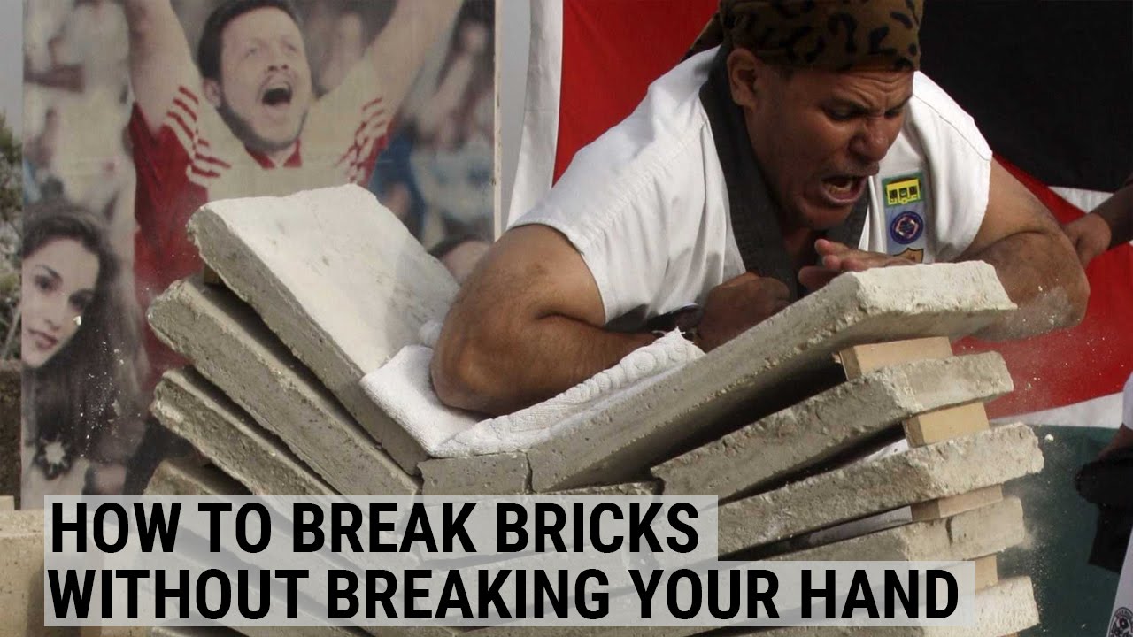 The physics of how to shatter bricks without breaking your hand
