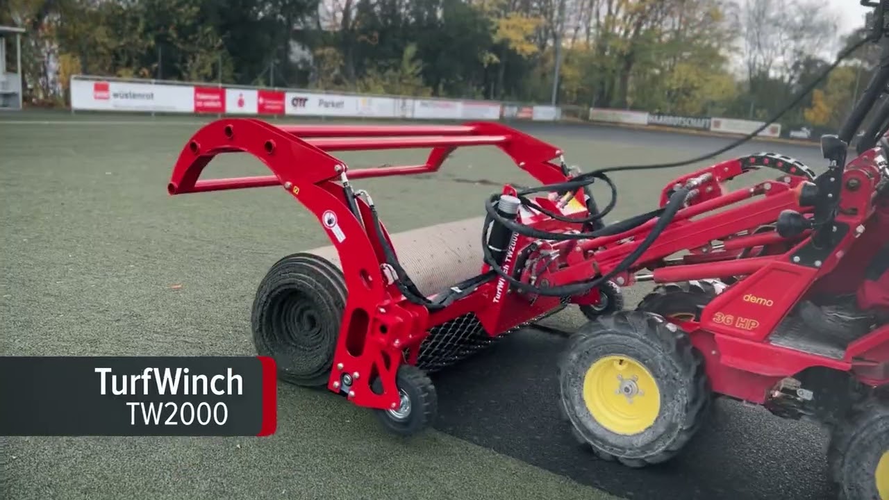 TurfWinchVario TWV attachment for winding and unwinding artificial turf.